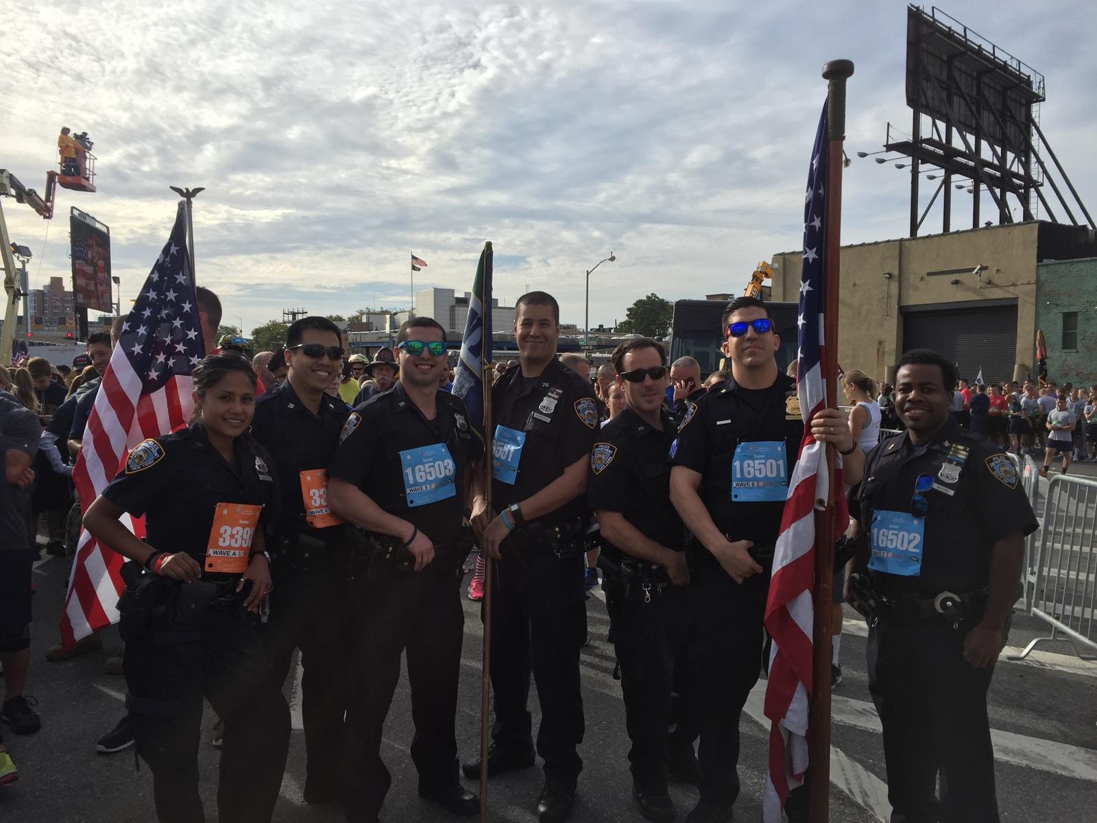 NYPD officers run in the tunnel to tower run in full uniform. | Scrolller