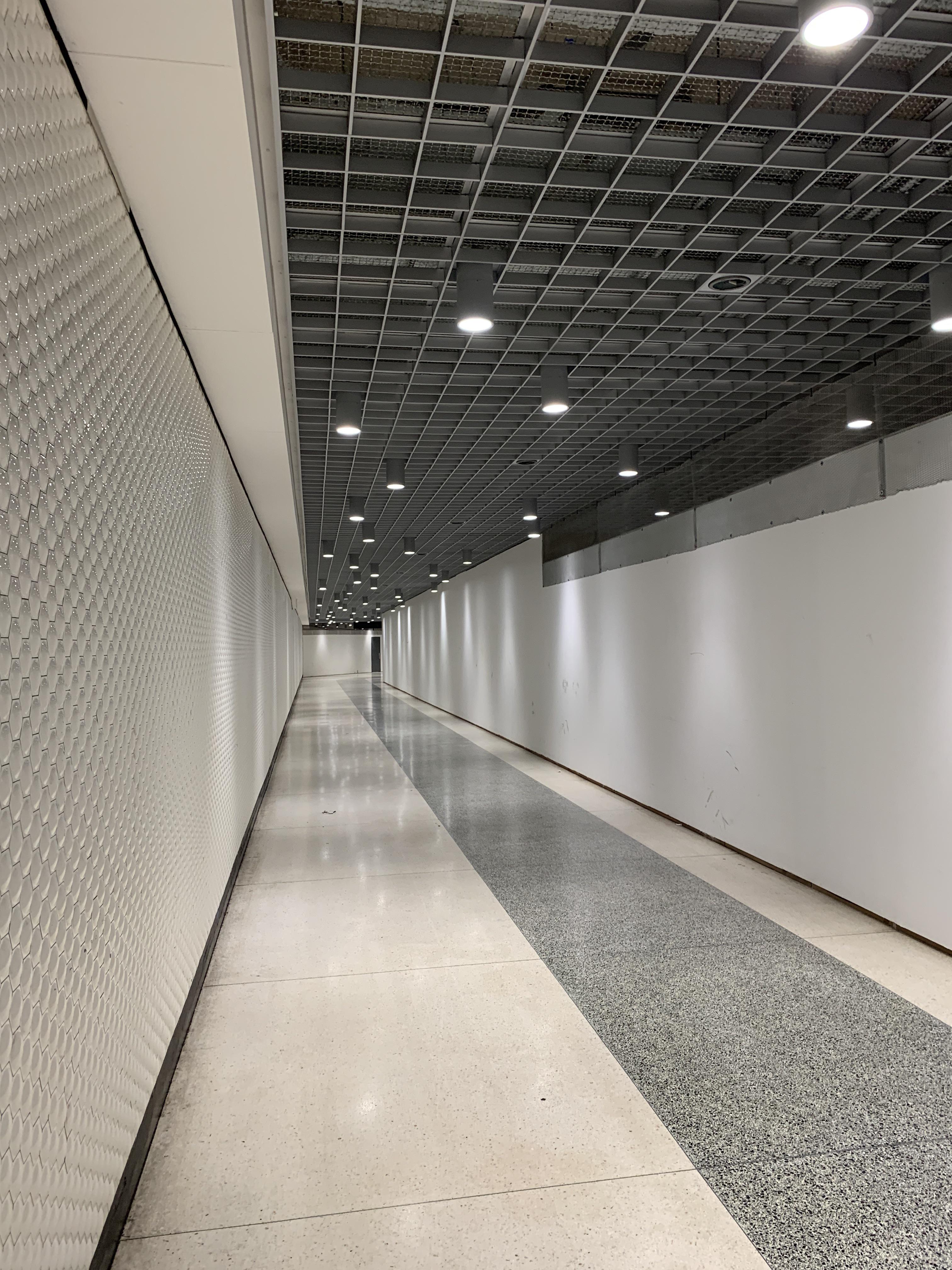 Oddly empty hallway in a BART station in San Francisco | Scrolller