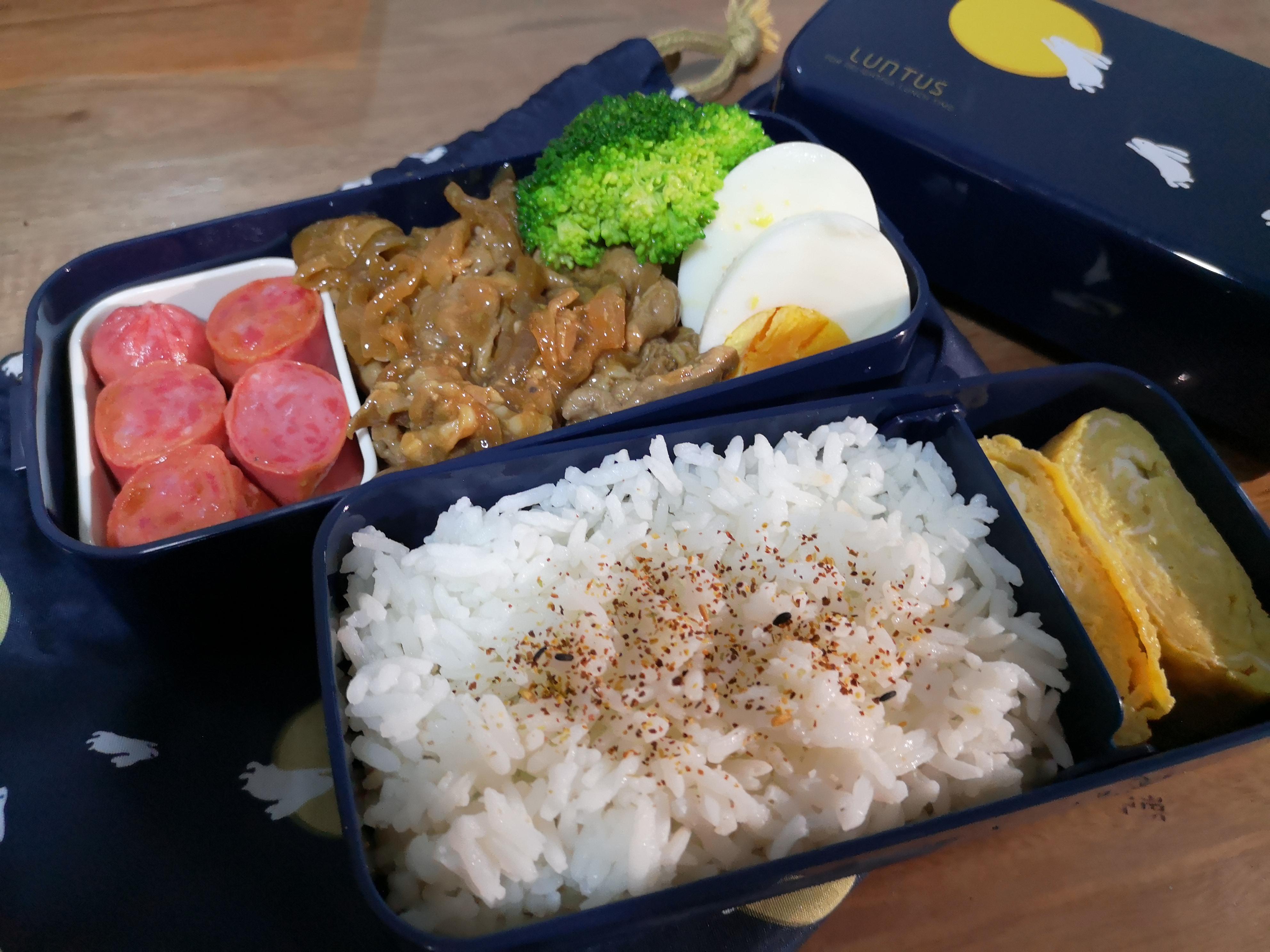 Pork shogayaki bento with tamagoyaki, sausage, and boiled egg | Scrolller