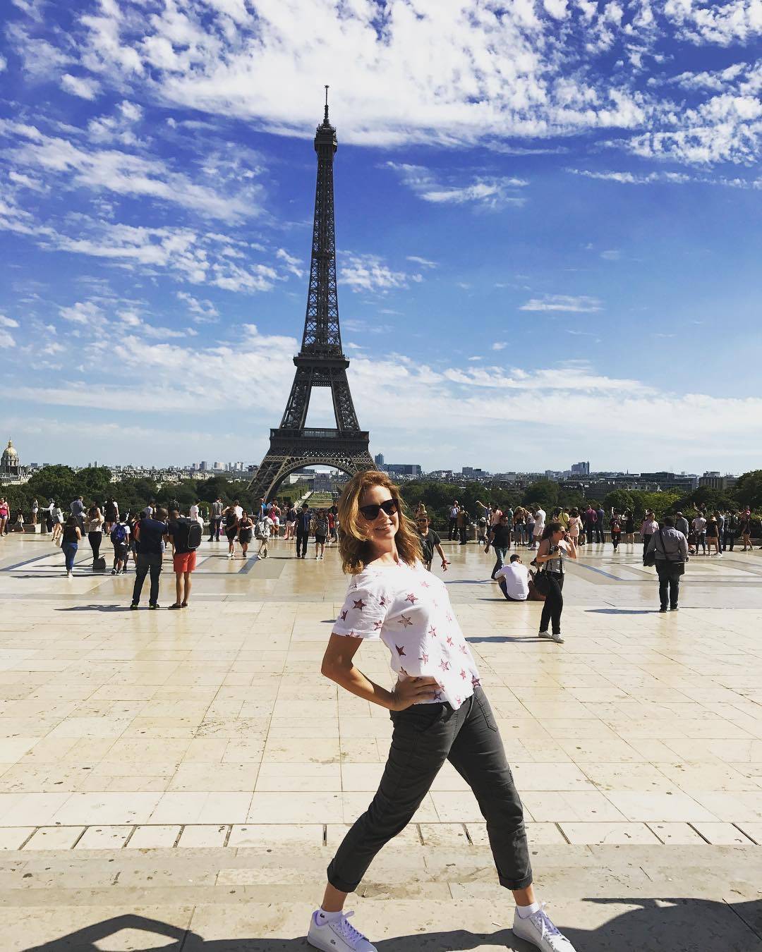 Posing in front of the Eiffel Tower | Scrolller
