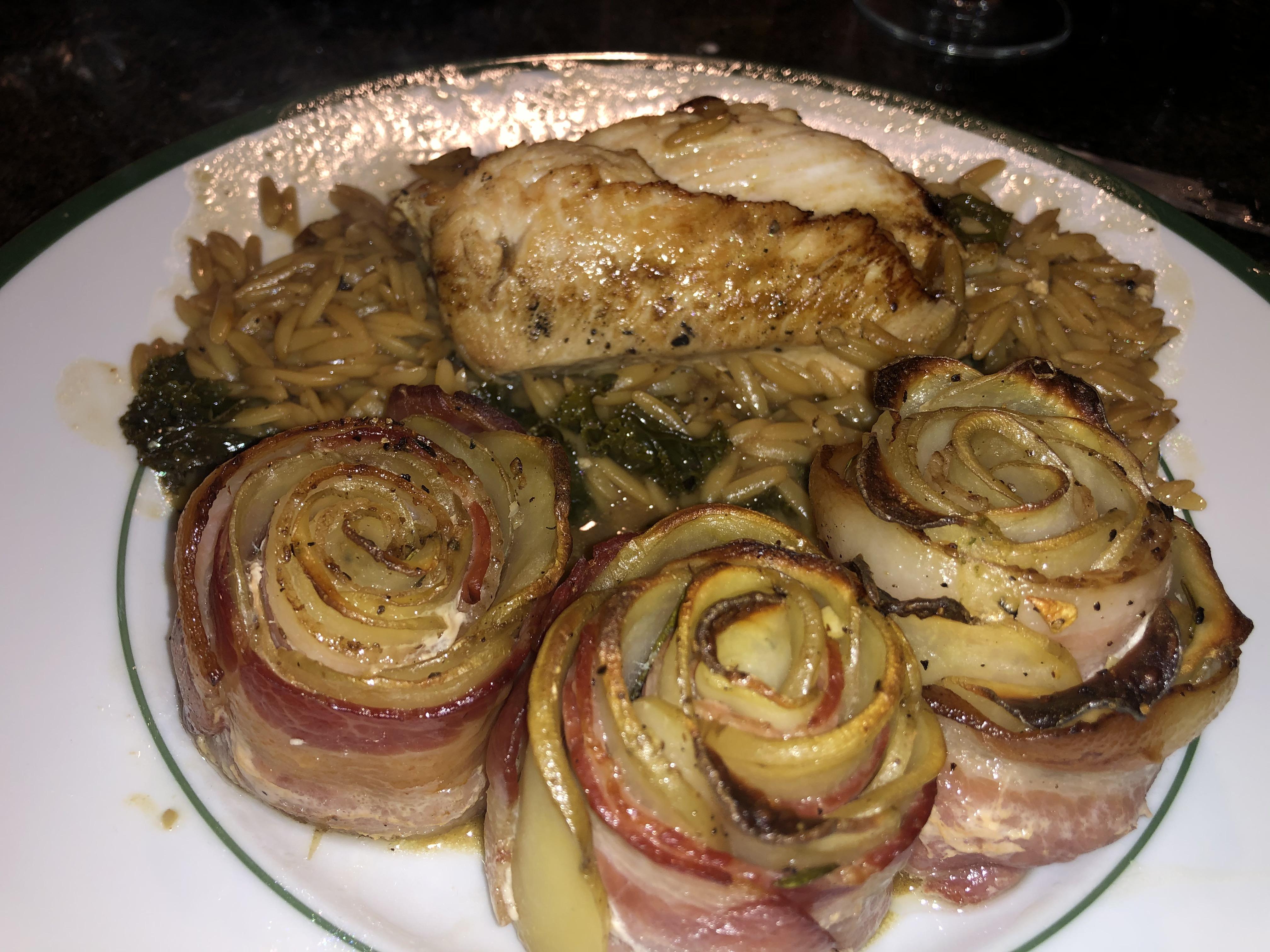 Potato/Bacon roses with goat cheese stuffed chicken breast over orzo | Scrolller