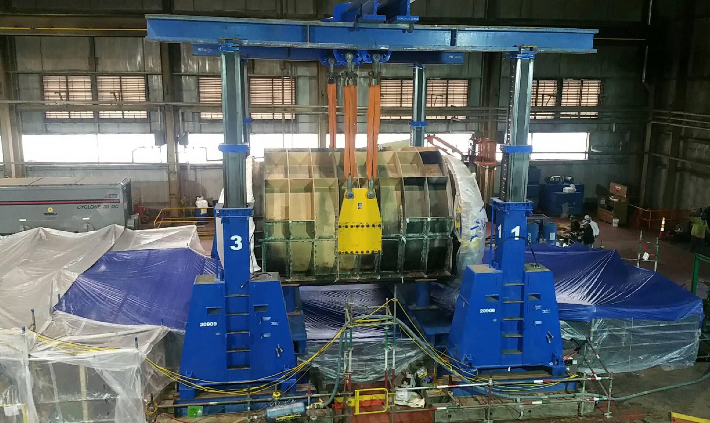 Power plant steam turbine generator being lifted up for inspection ...