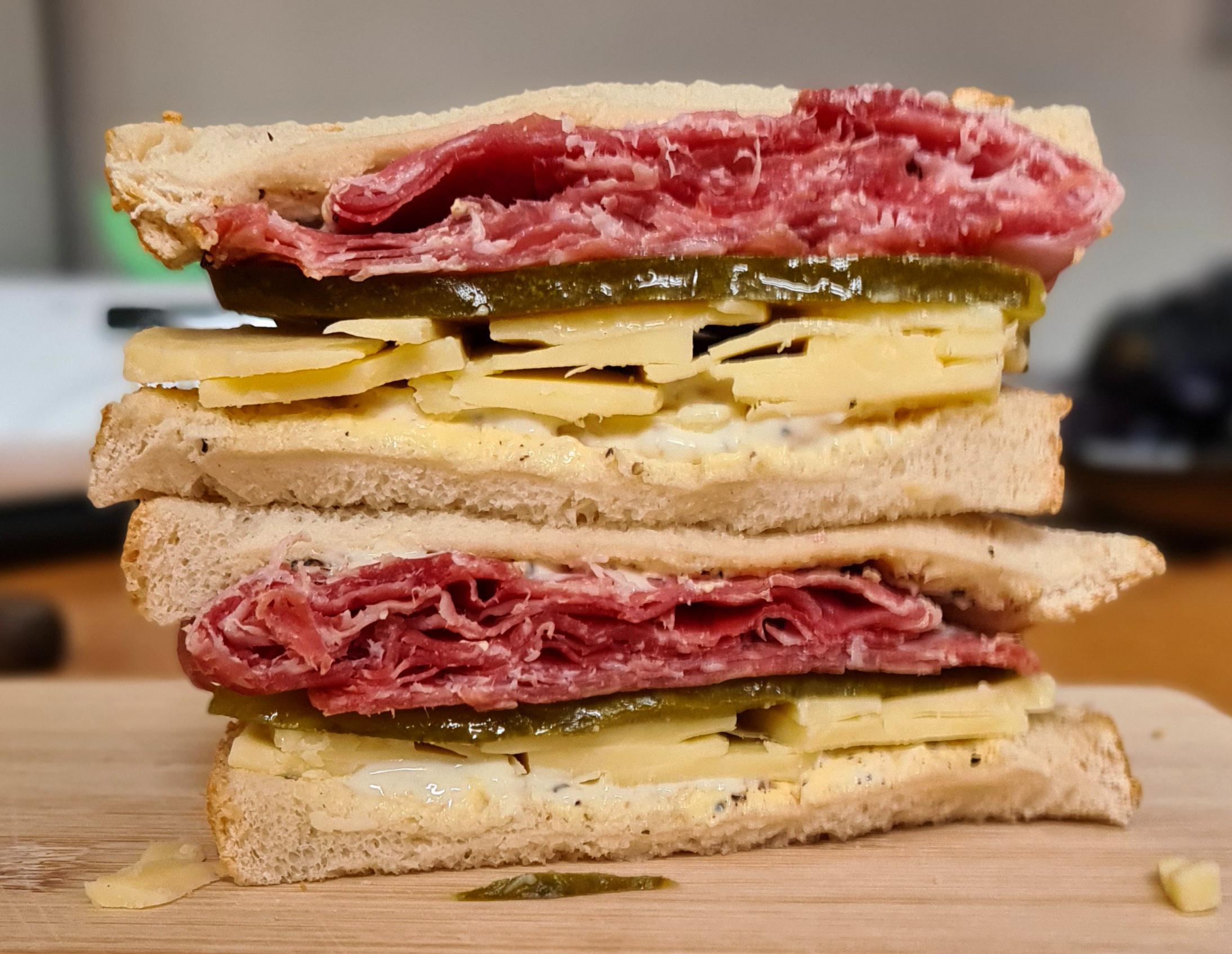 Prosciutto, salami, coppa, pickles, mature cheddar, black pepper mayo on tiger bread. | Scrolller