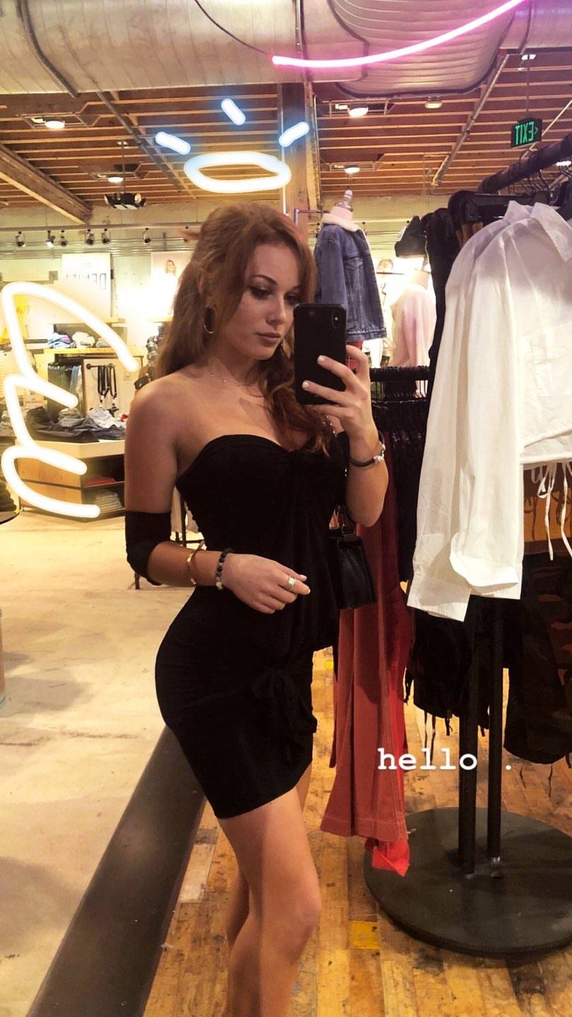 Redhead in black | Scrolller