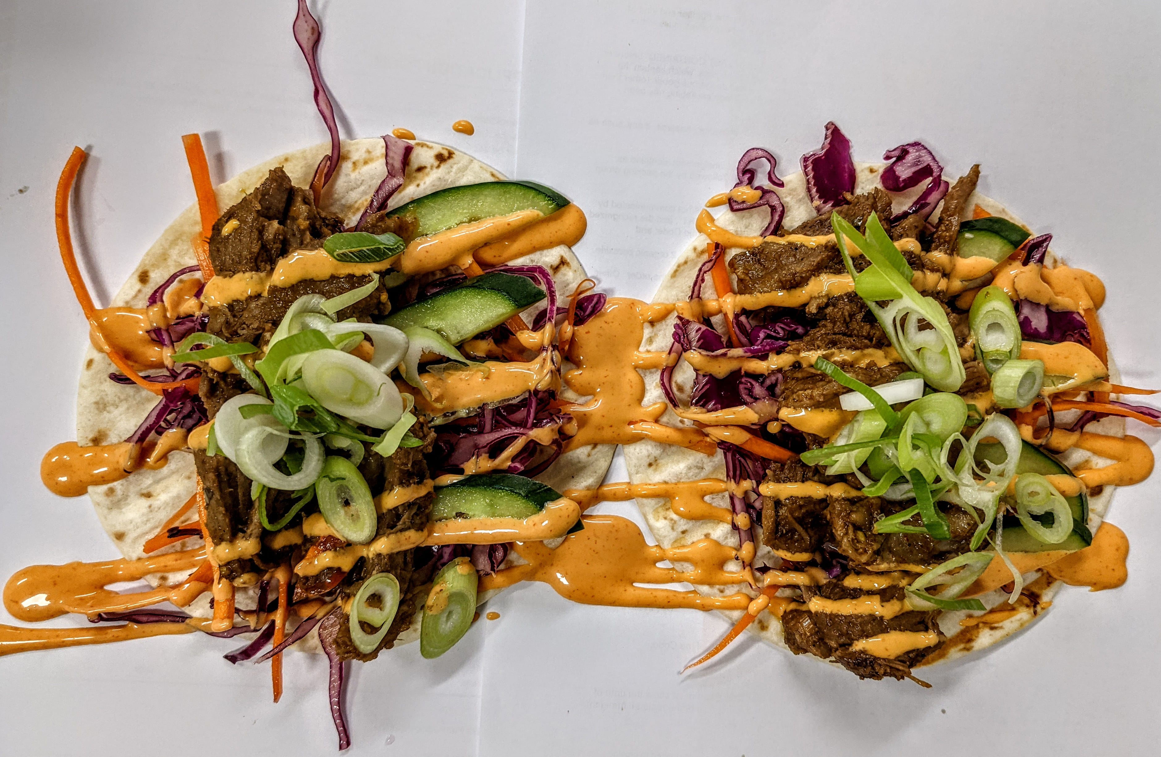 Rendang tacos. Lamb, pickled slaw and cucumber with Sriracha Kewpie. | Scrolller