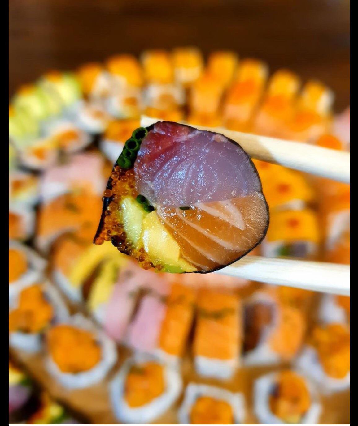 Salmon, yellowtail, avocado, tobiko, scallion | Scrolller