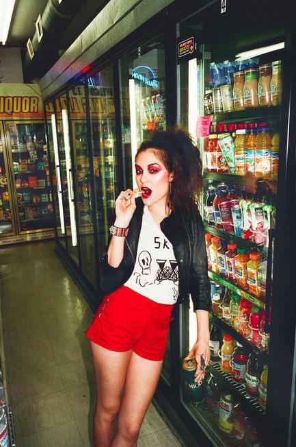 Sasha sucking a lollipop in a grocery store | Scrolller