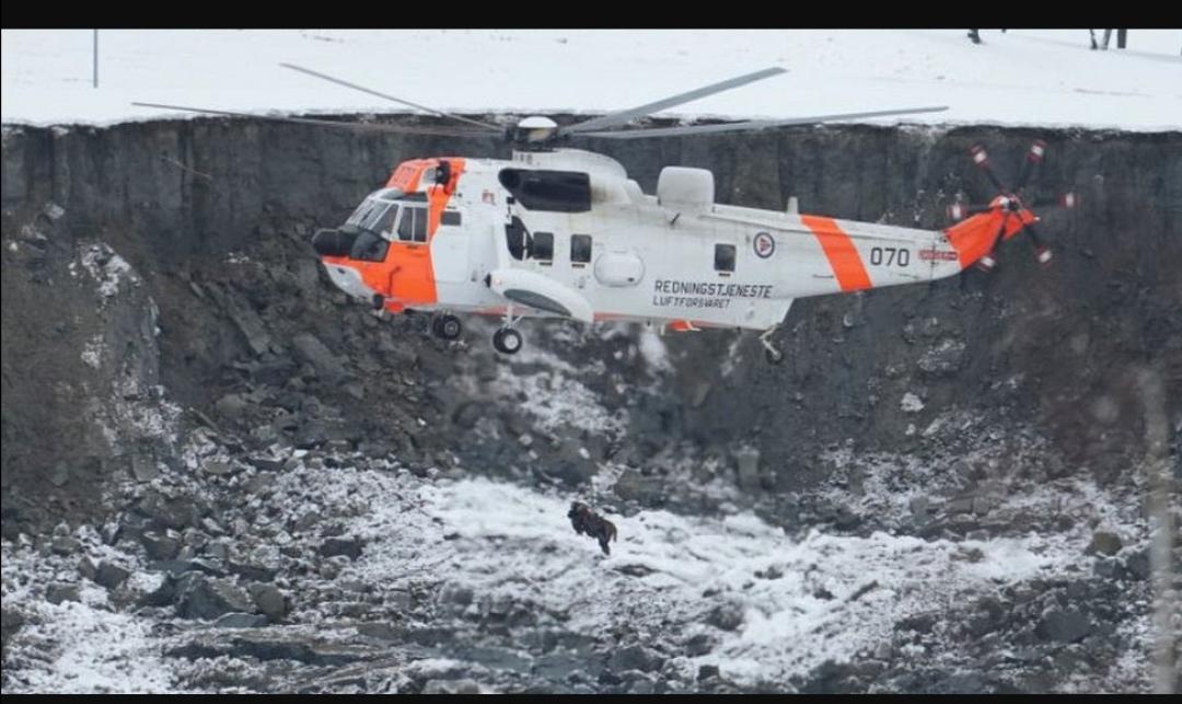 Search and rescue dog being airlifted into a town in Norway affected by a huge mudslide | Scrolller