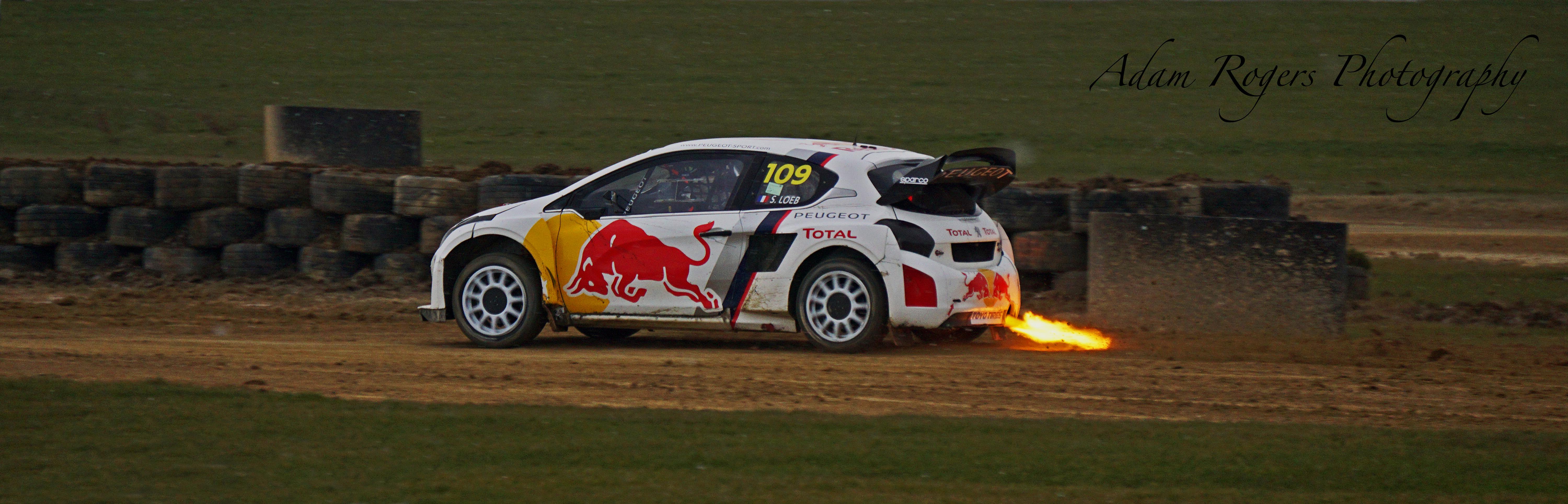 Sebastian Loeb spitting some flames at Silverstone last year | Scrolller