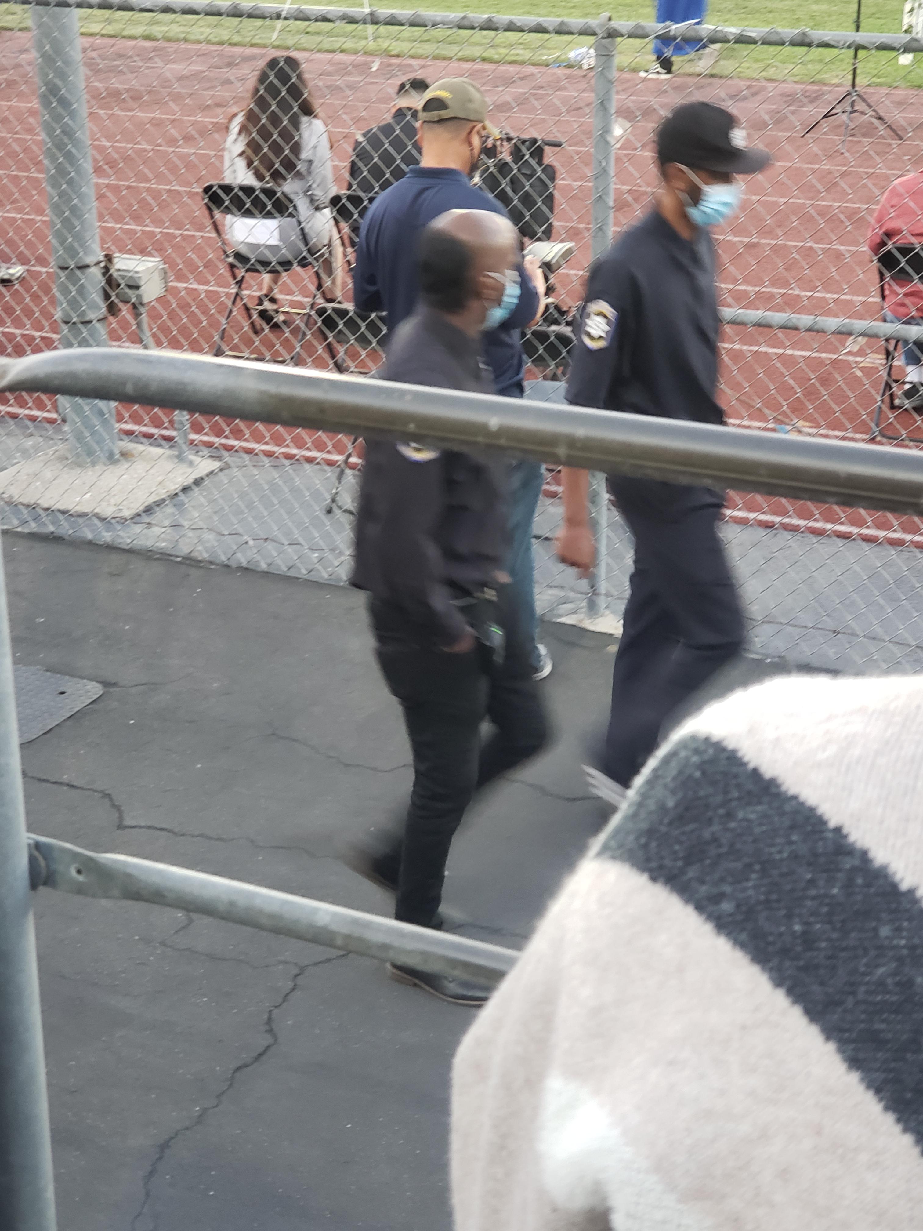 Security guard at a graduation ceremony | Scrolller