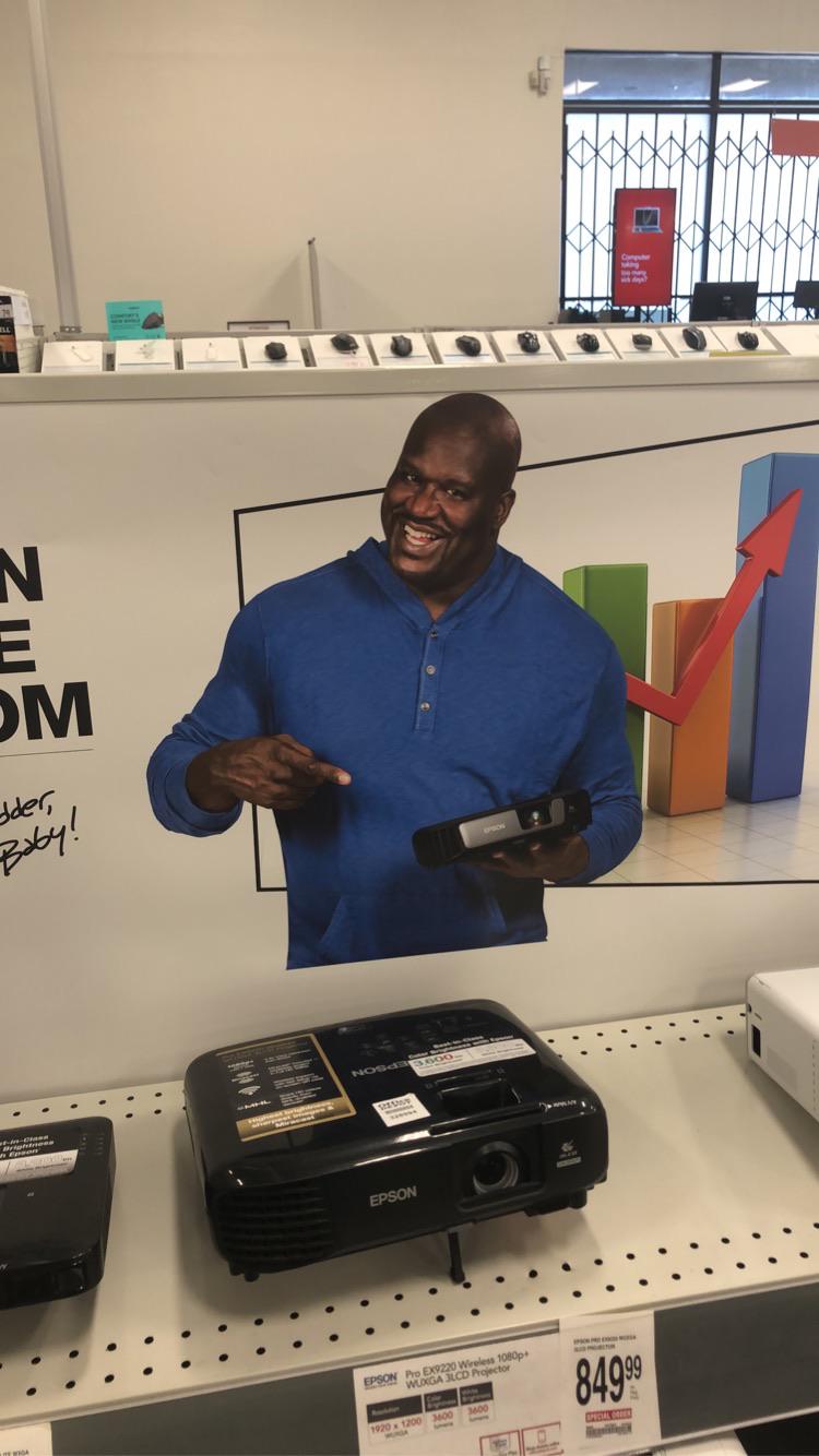 Shaq holding a projector | Scrolller