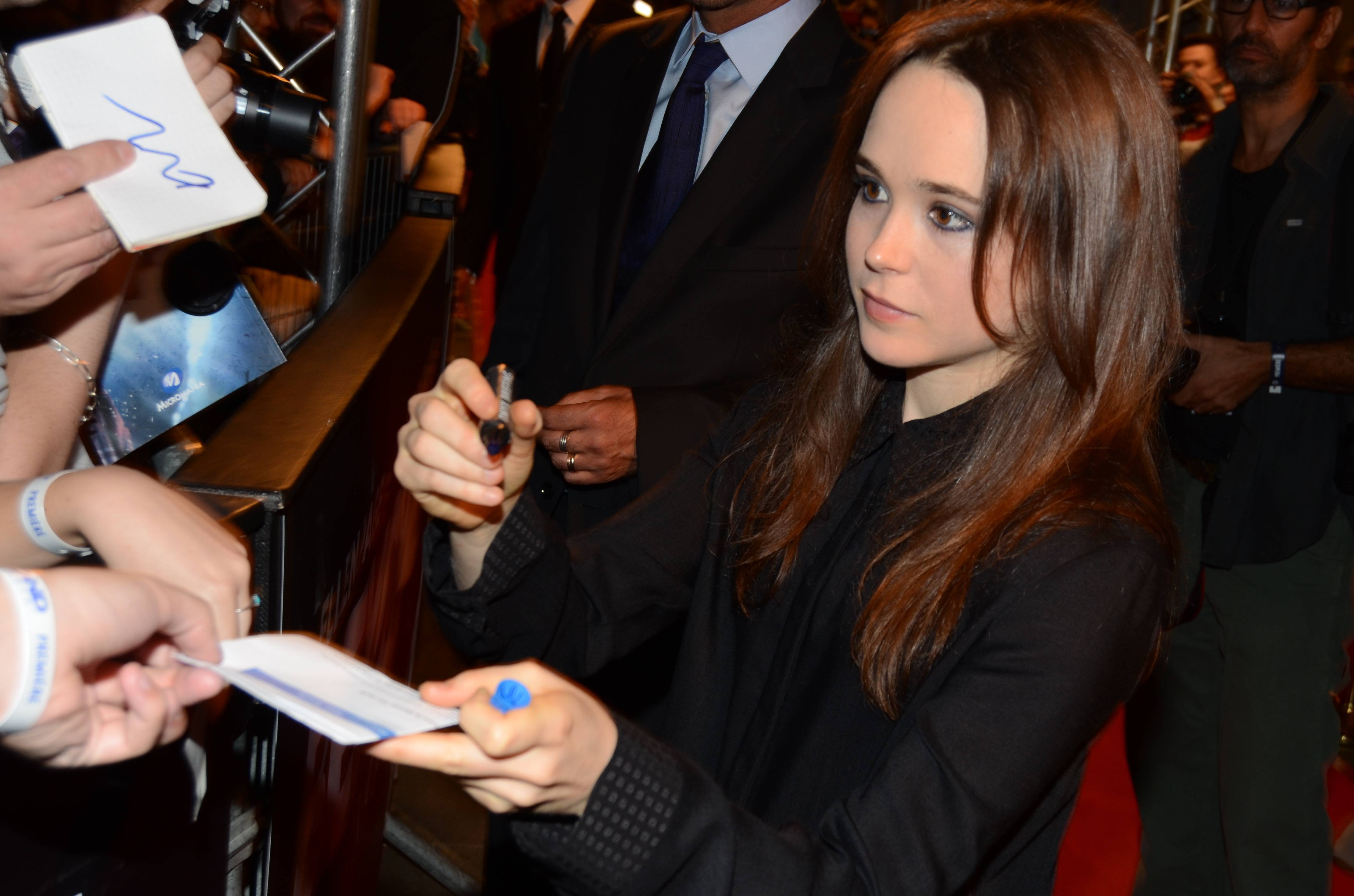 Signing autographs | Scrolller