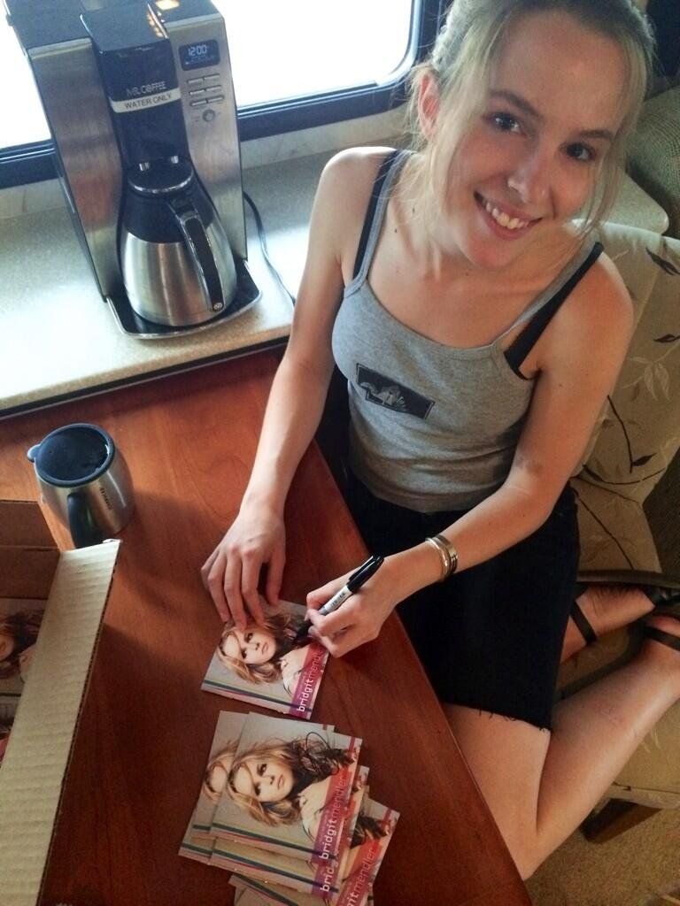 Signing CDs | Scrolller