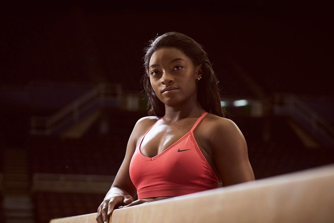 Simone posing at the beam | Scrolller