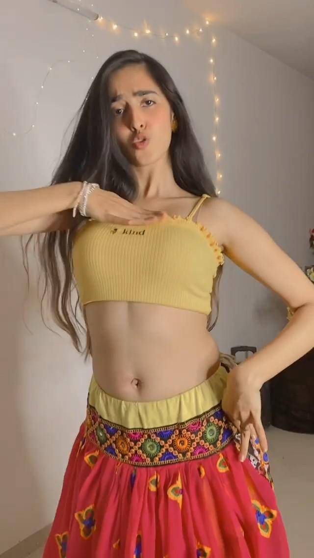 Simrat Kaur navel in yellow top and red skirt | Scrolller