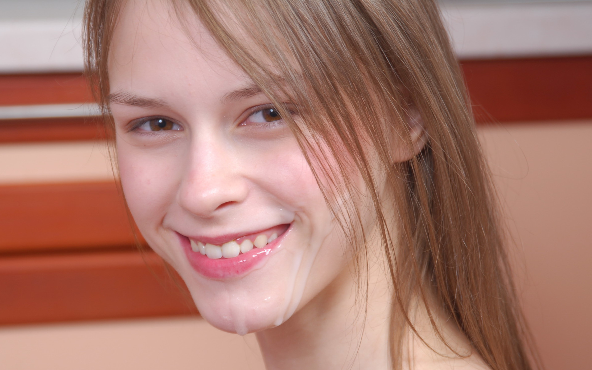 Smiling with cum on her face | Scrolller