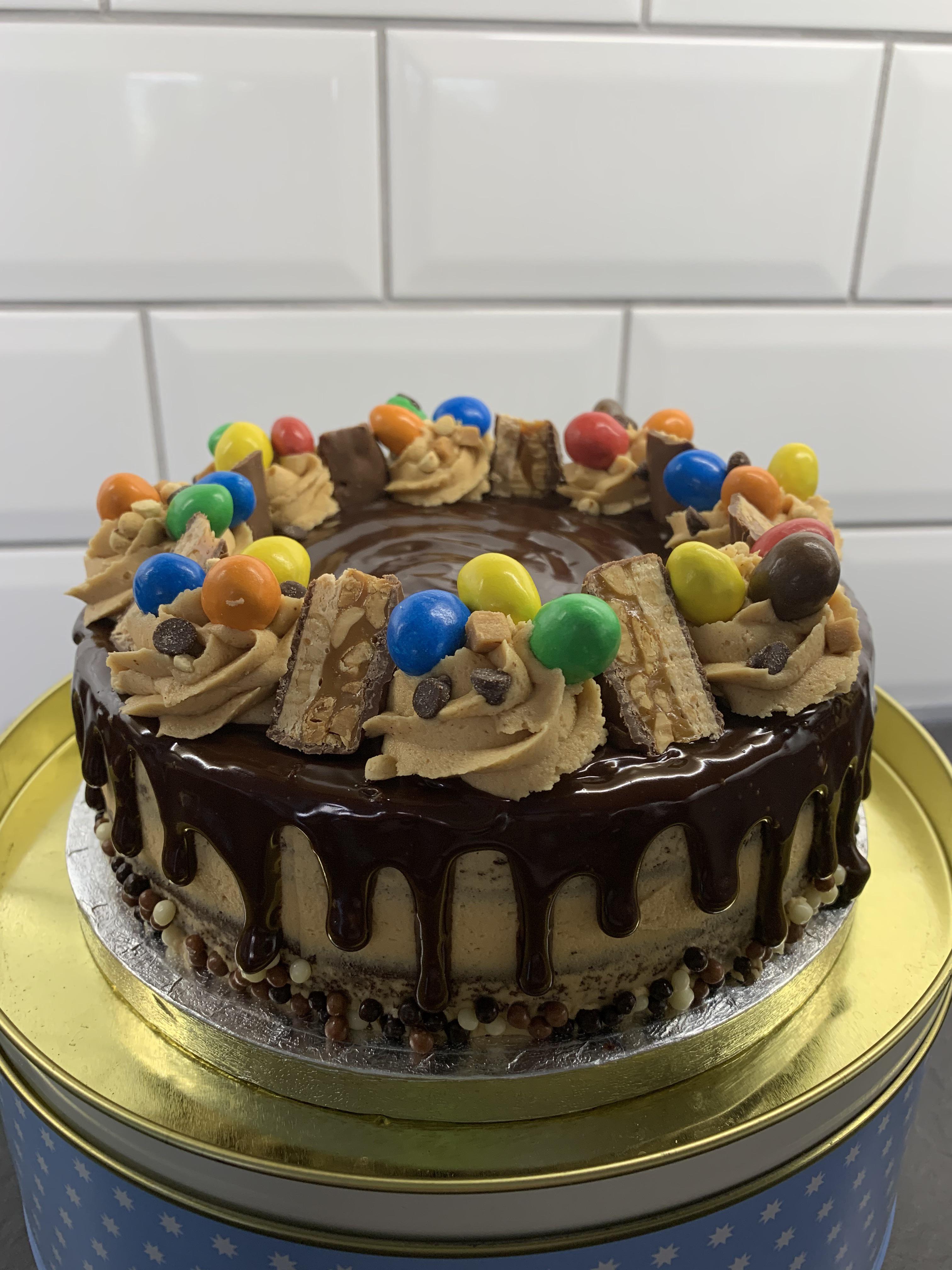 Snickers cake with peanut buttercream and caramel inside. | Scrolller