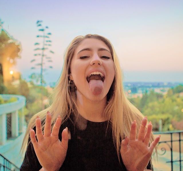 Sticking her tongue out | Scrolller