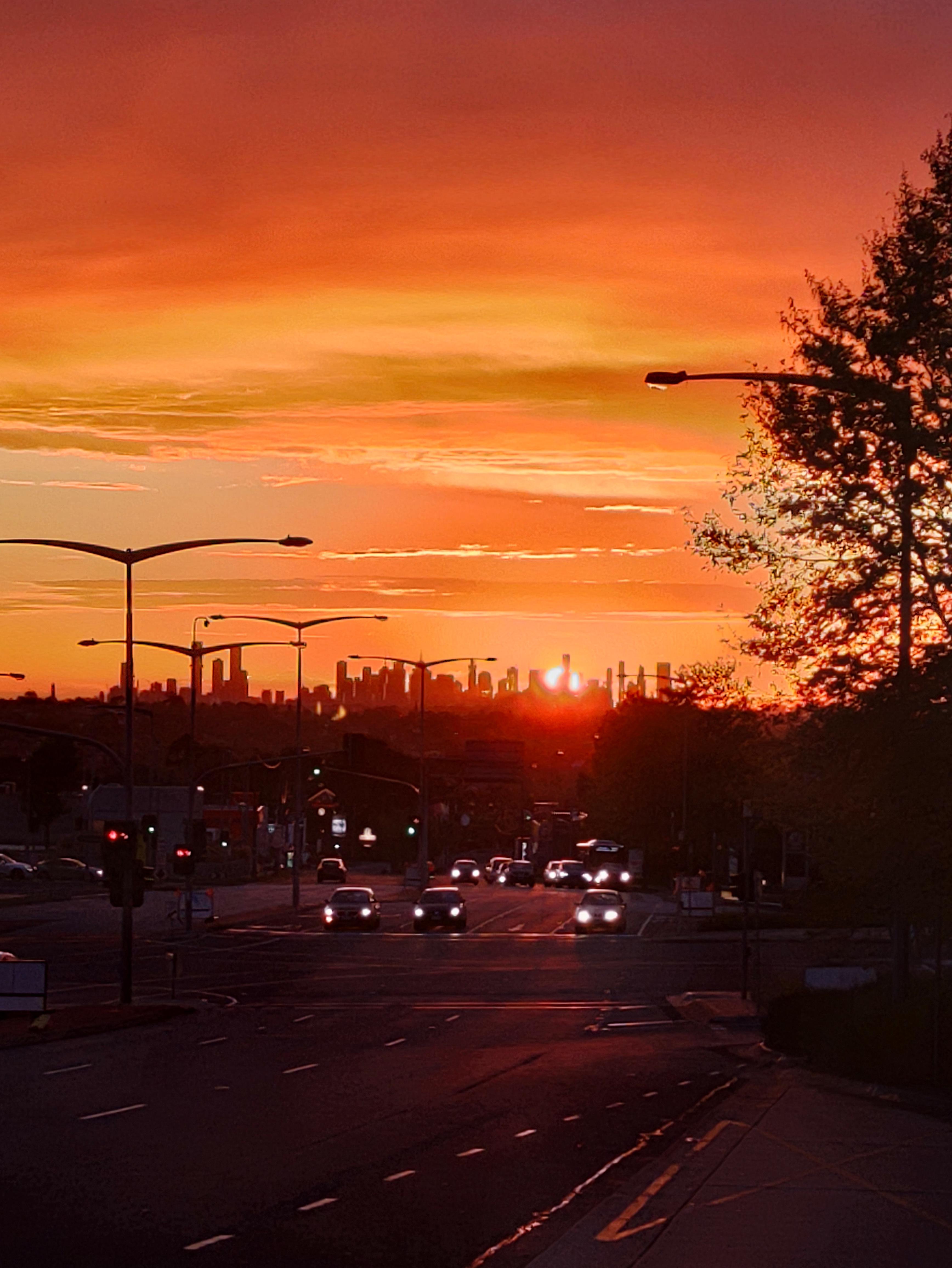 Sunset behind city skyline in Melbourne | Scrolller