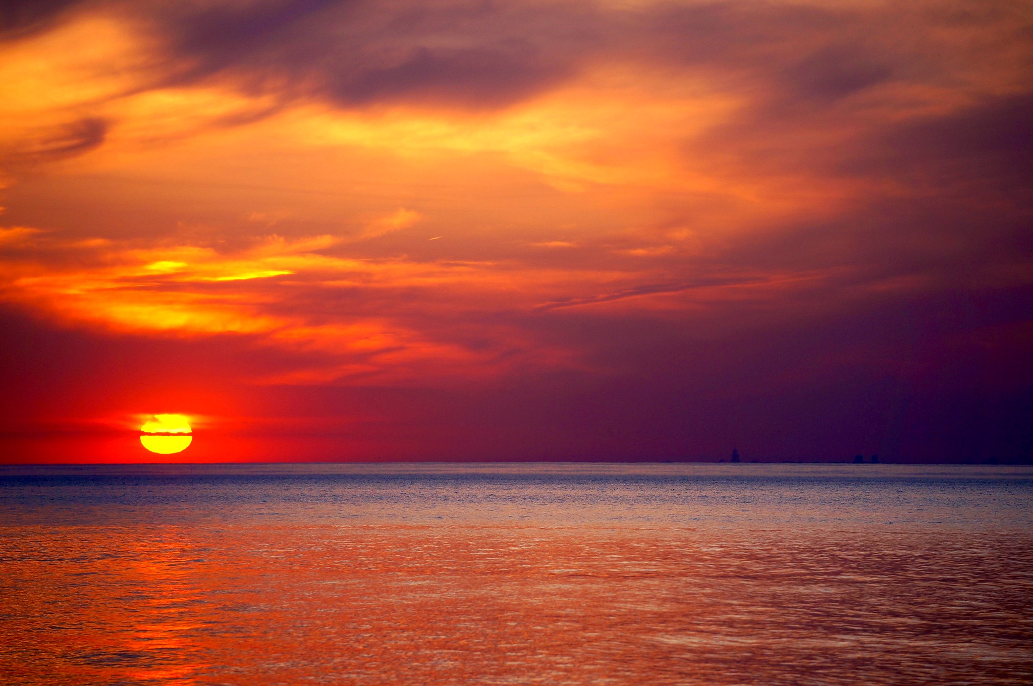 Sunset on Lake Michigan with Chicago skyline on the horizon | Scrolller