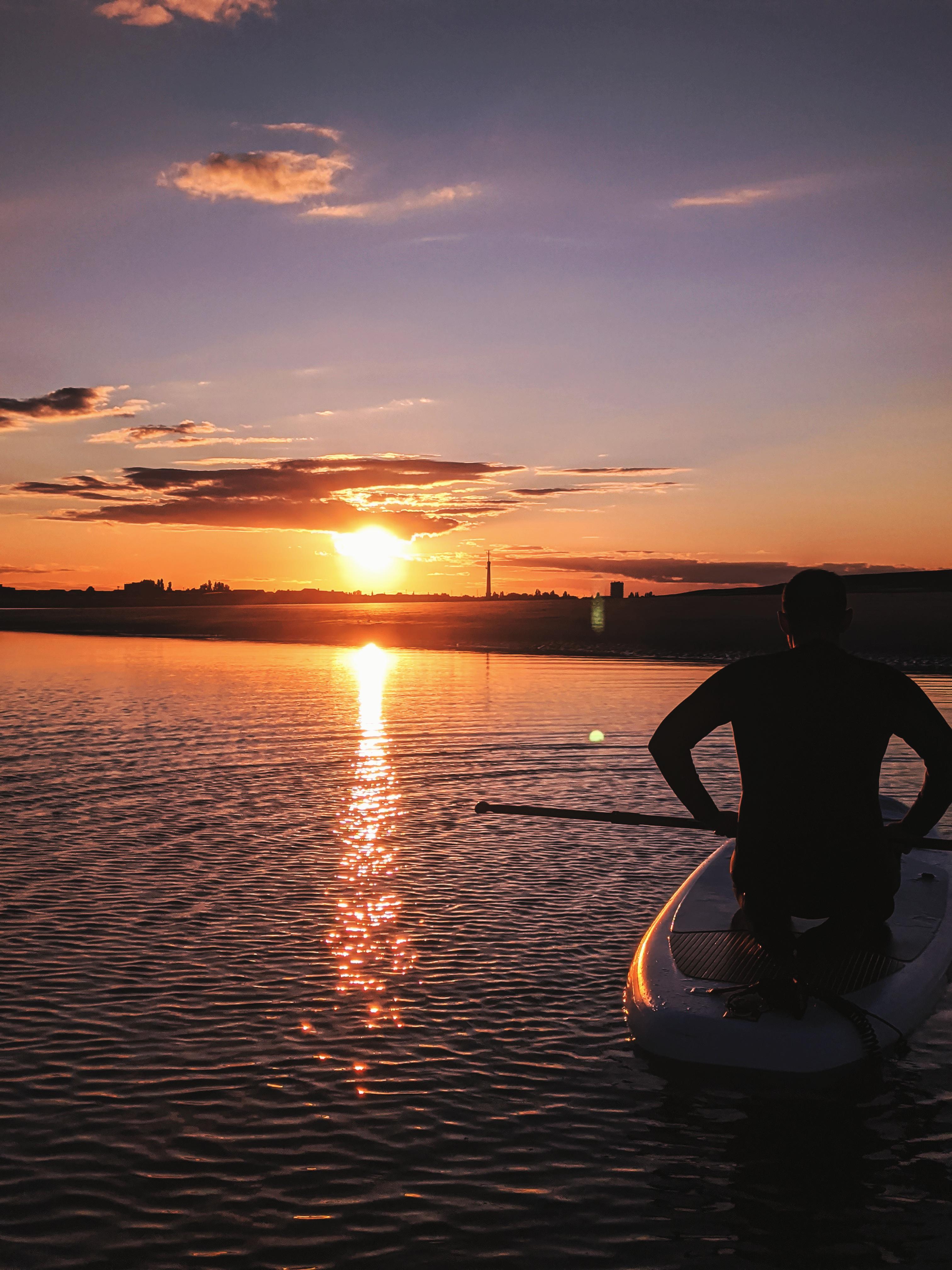 Sunset paddle last night, I've never seen the beach so quiet! | Scrolller