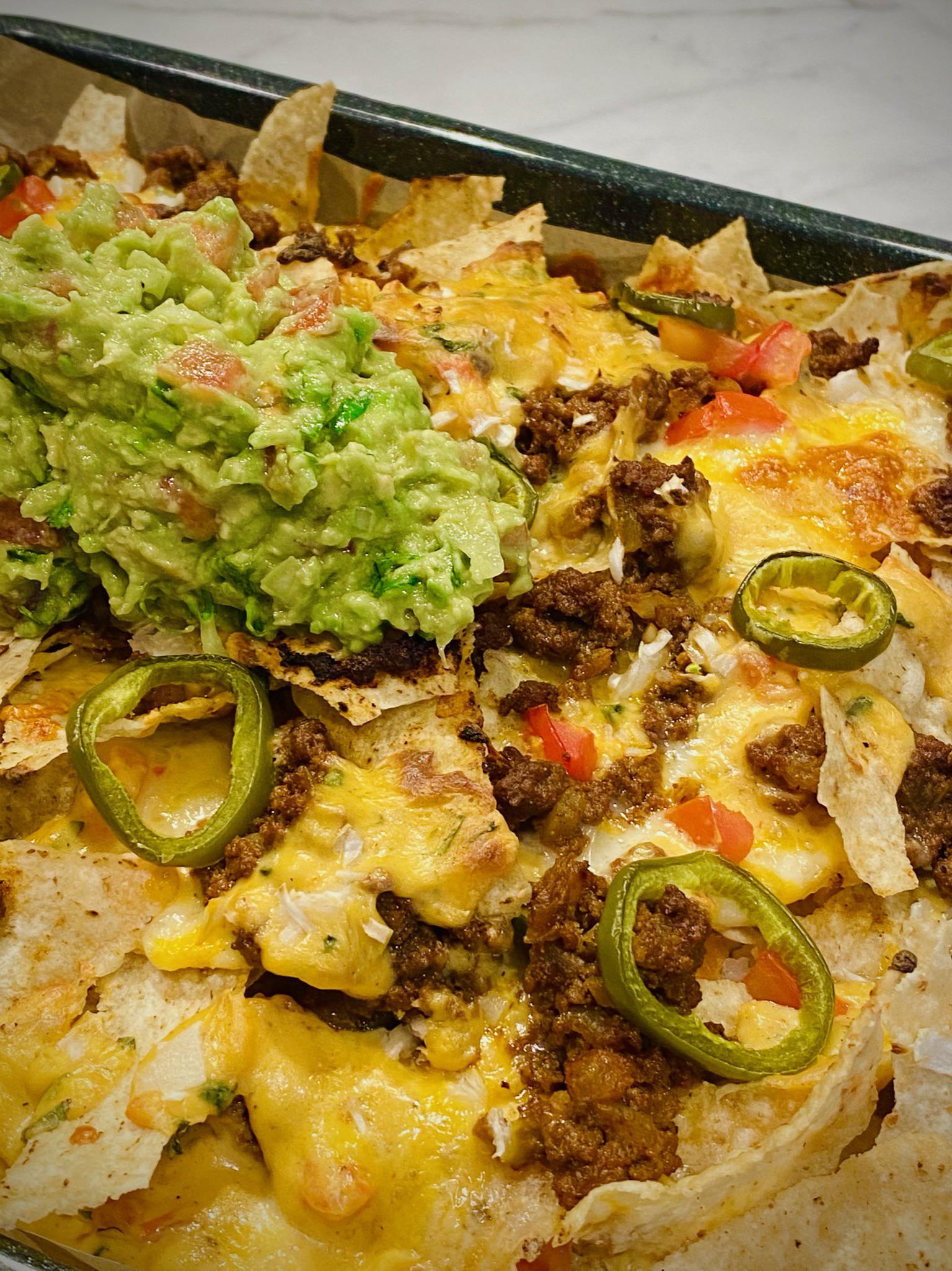 Super Bowl Nachos: Guac, Queso, Ground beef, Pickled Jalapeños, Cheddar, Pepper Jack, Tomatoes ...