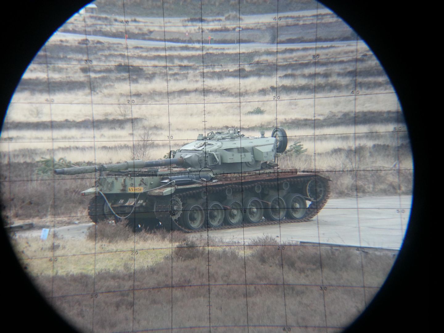 Tank at Shooting Range through Scoop | Scrolller