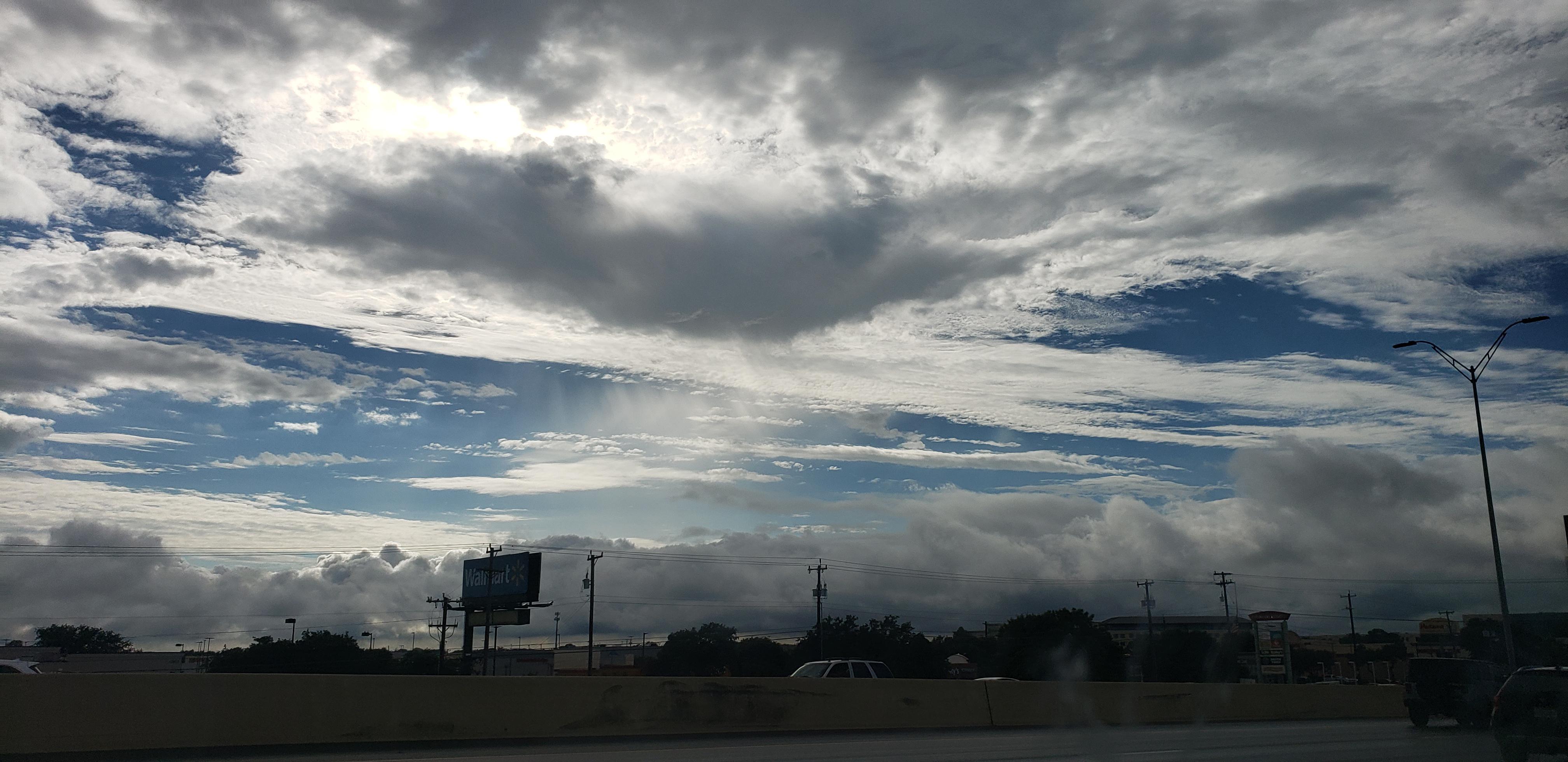 The different depths of clouds are beautiful. On the bottom is storm that had passed over ...