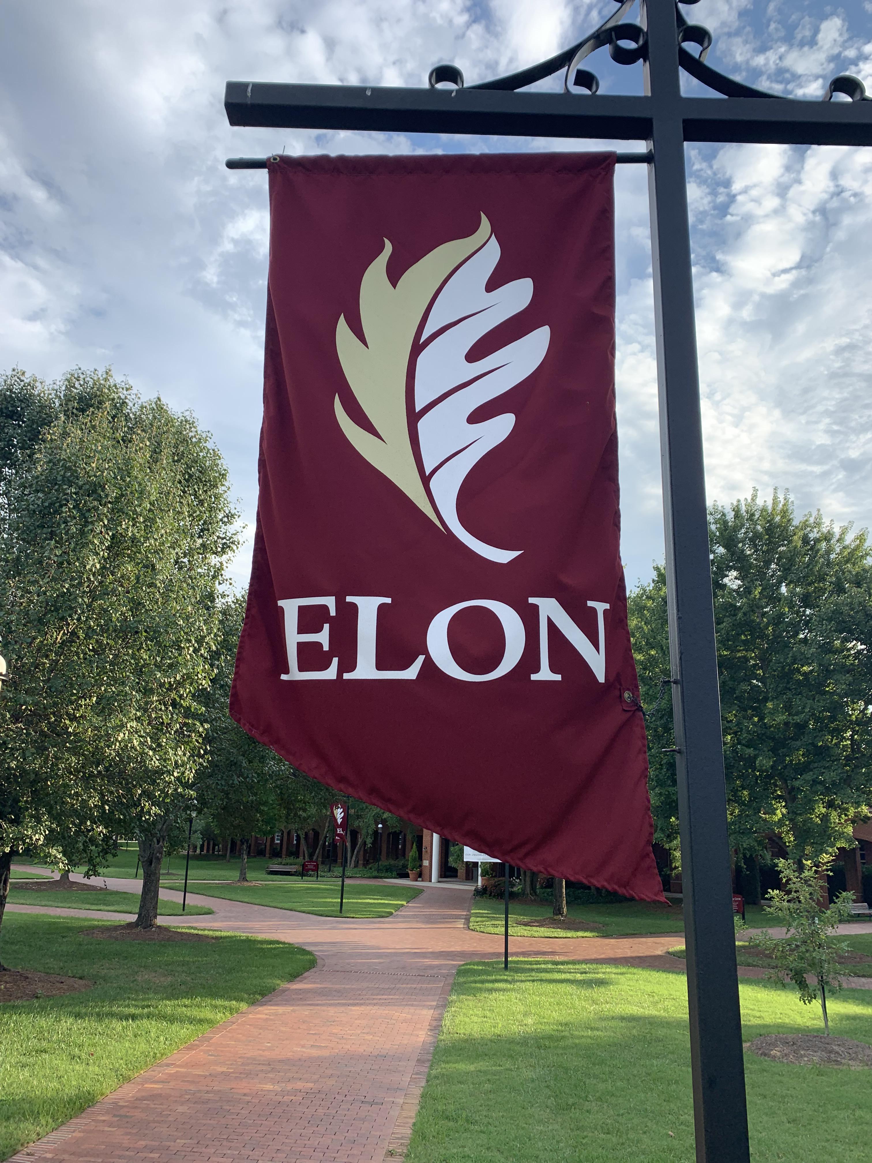 The logo for Elon University after the school burned down in the 1920s. Half flame, half oak ...