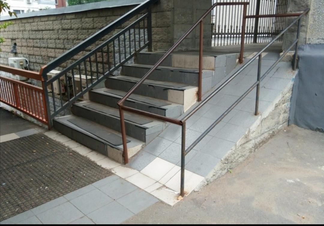 The railing is to protect the wheelchair user going down the ramp! | Scrolller