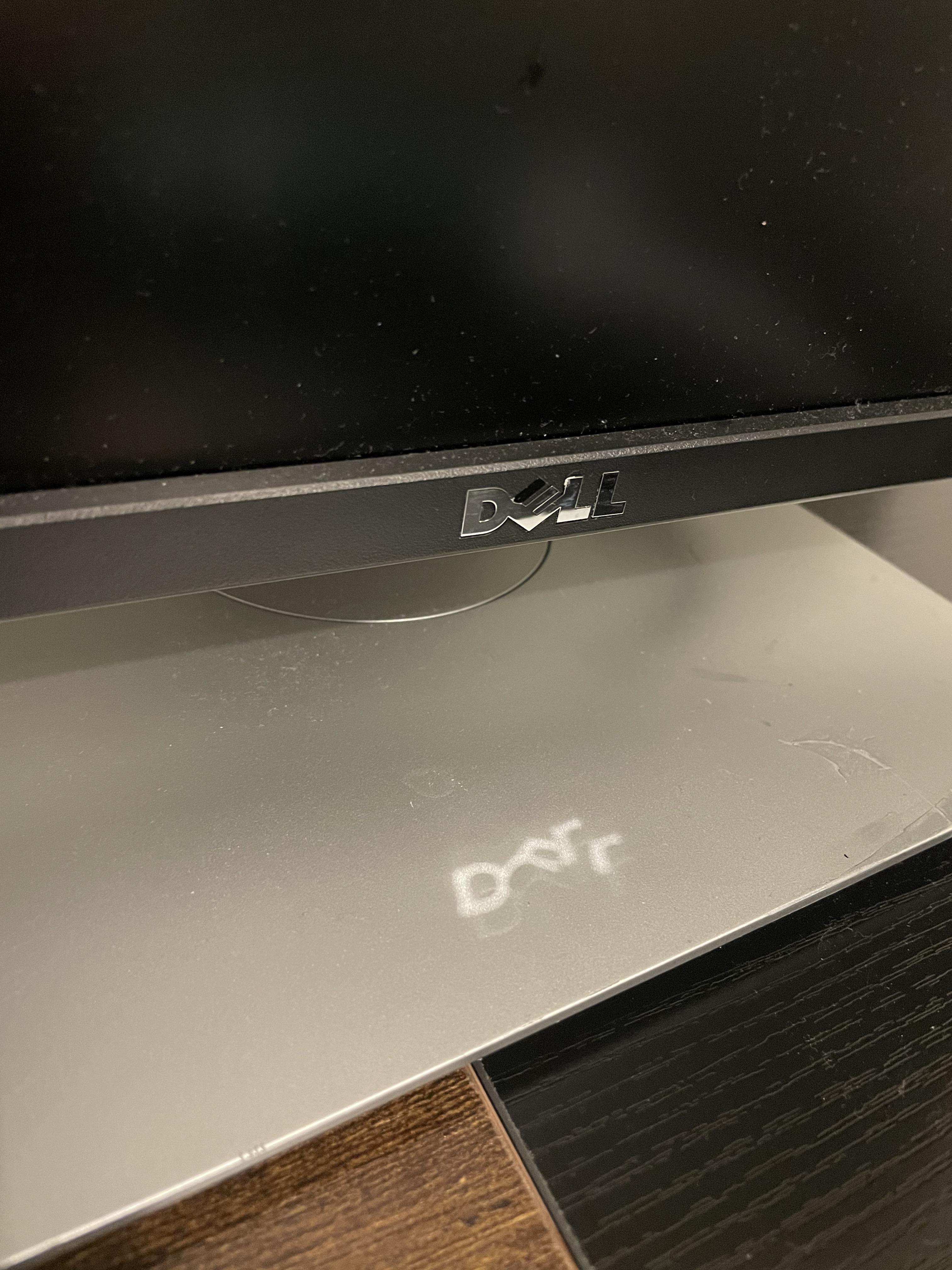 The reflection of the Dell logo on my work monitor | Scrolller