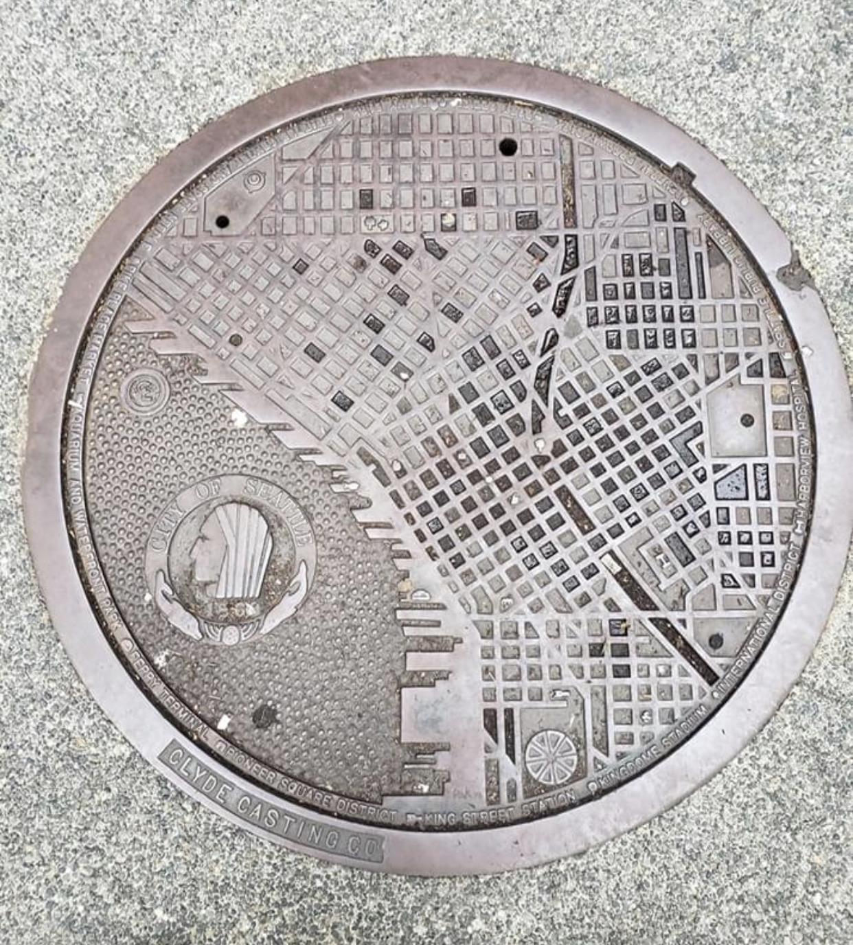 This manhole cover at 4th and Seneca depicts an older downtown Seattle including the long dead ...