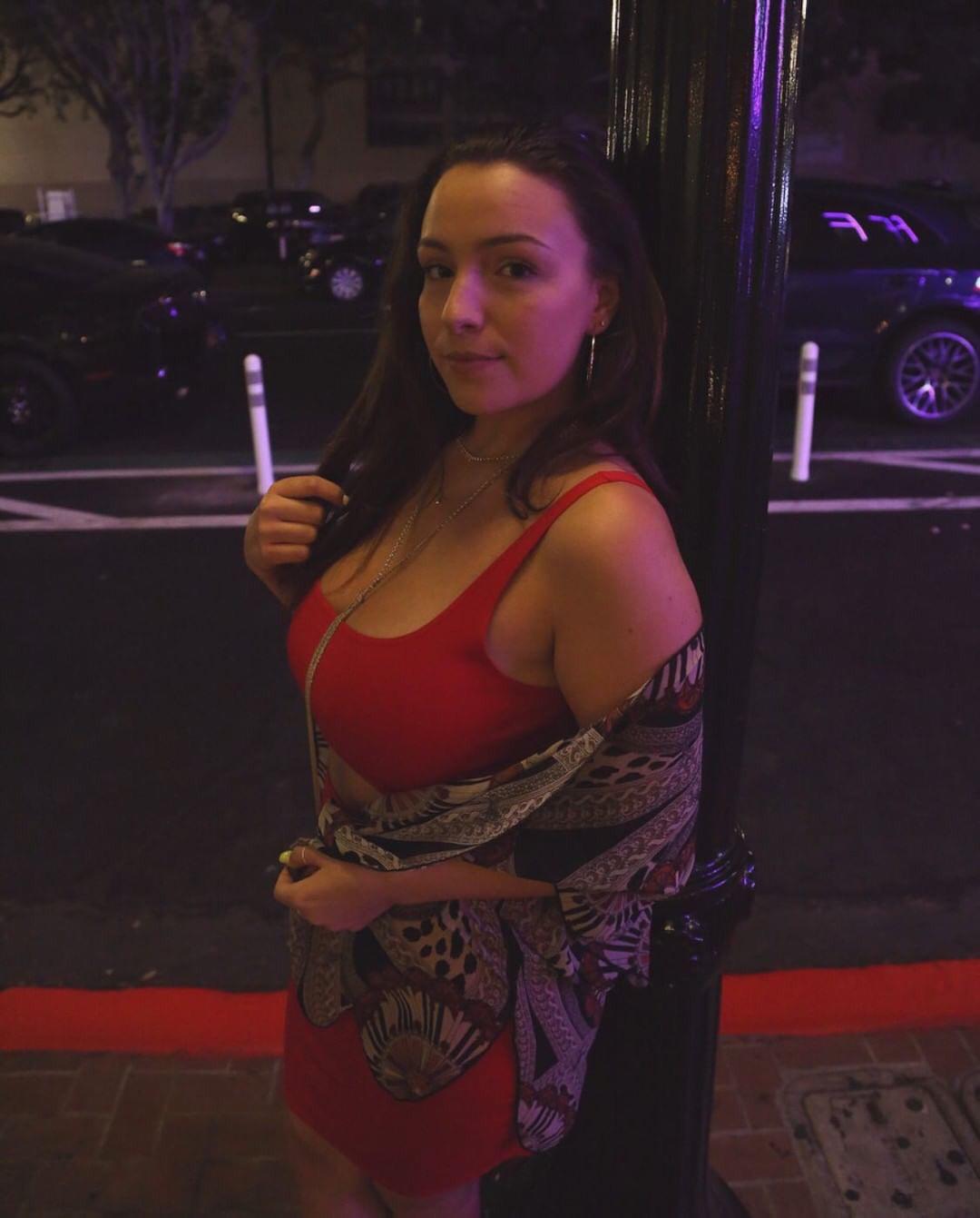 Tight red dress on busty brunette | Scrolller