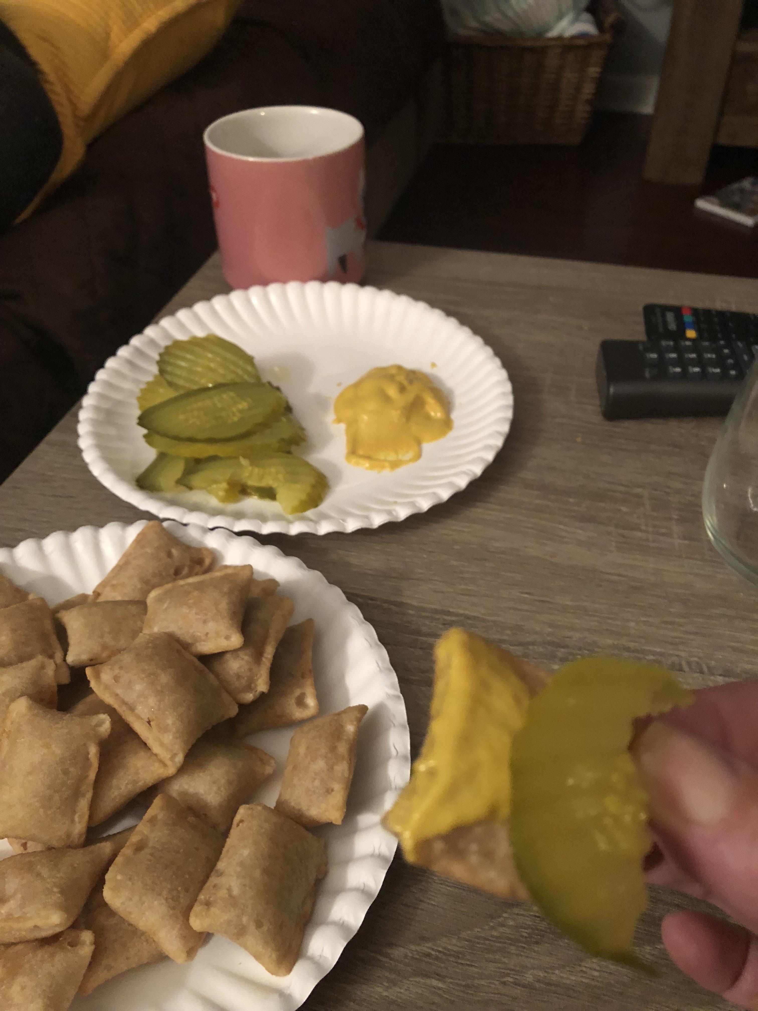 Tonight’s munch. Pepperoni pizza rolls, yellow mustard and dill pickles | Scrolller