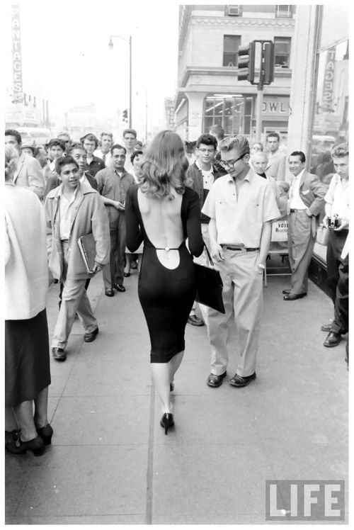 Vikki Dougan walking down the street// Circa. 1950 | Scrolller