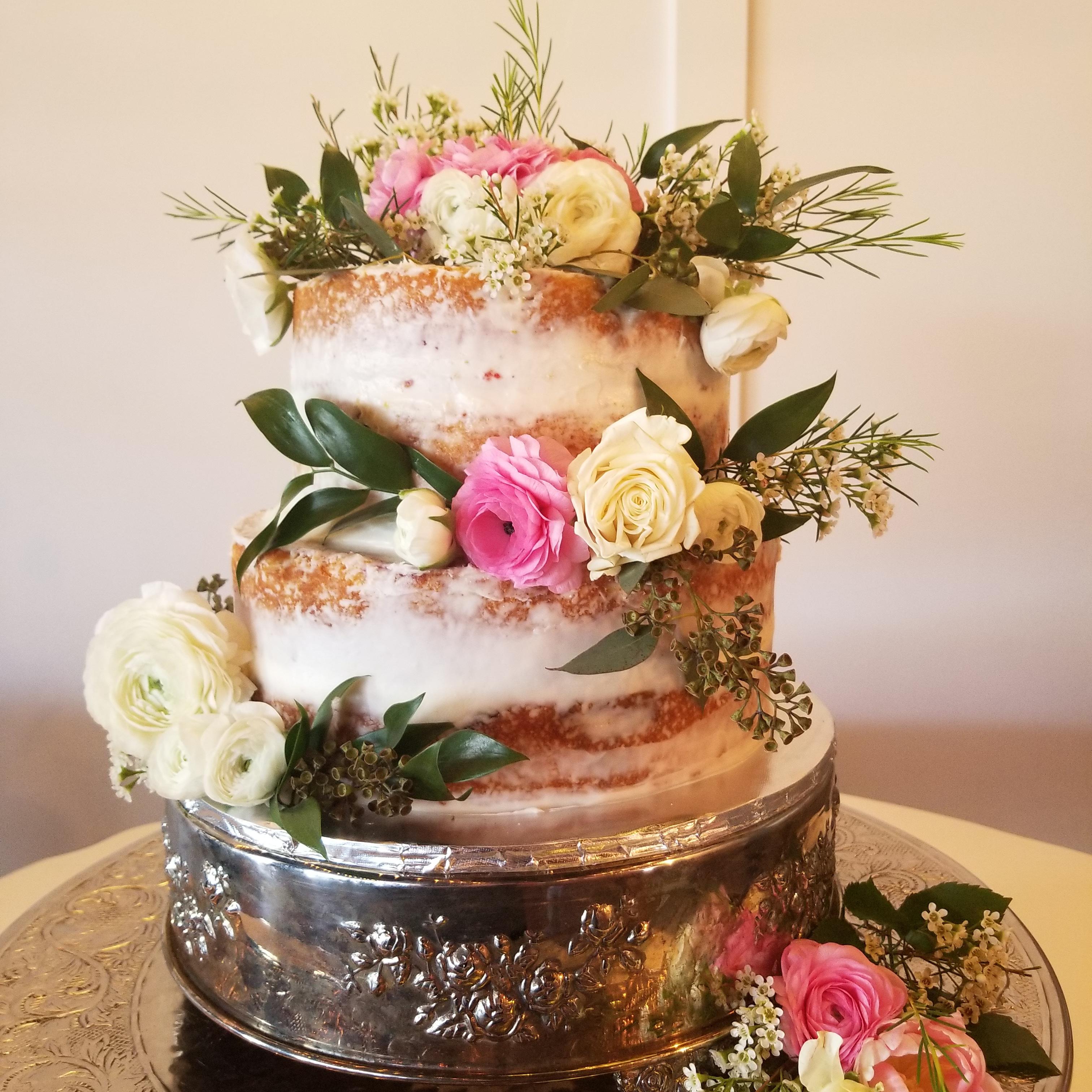 White cake with strawberry cream filling and buttercream icing. | Scrolller