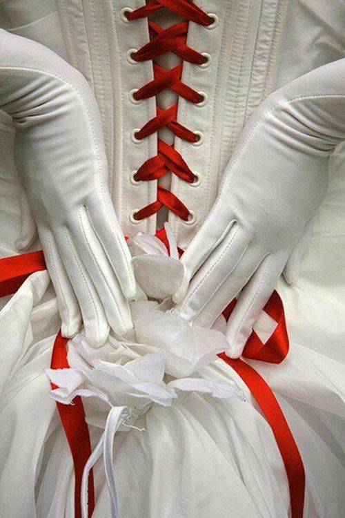White corset, red ribbon | Scrolller