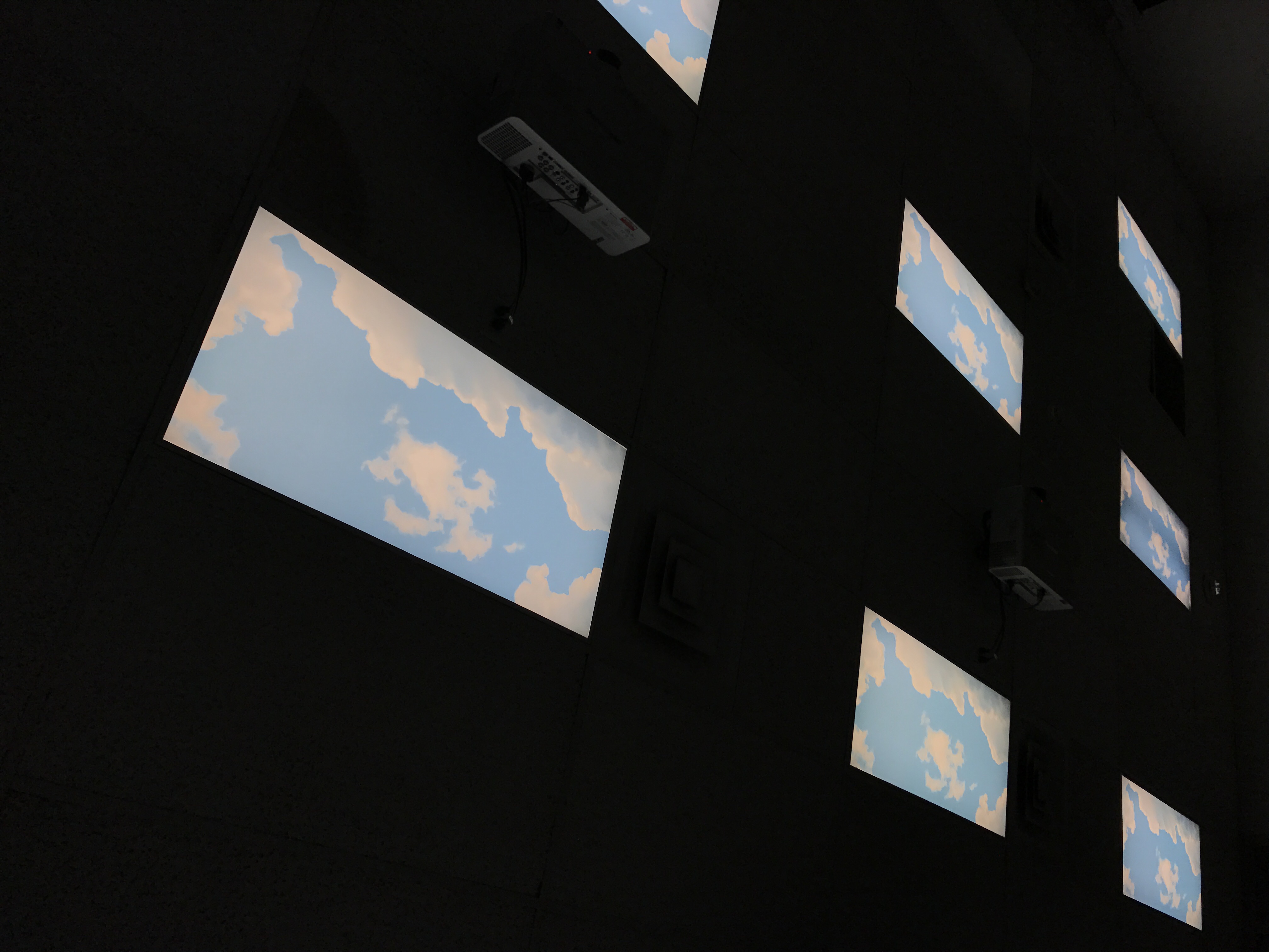 Windowless classroom has fake sky panels in place of the plastic covers on the fluorescent ...