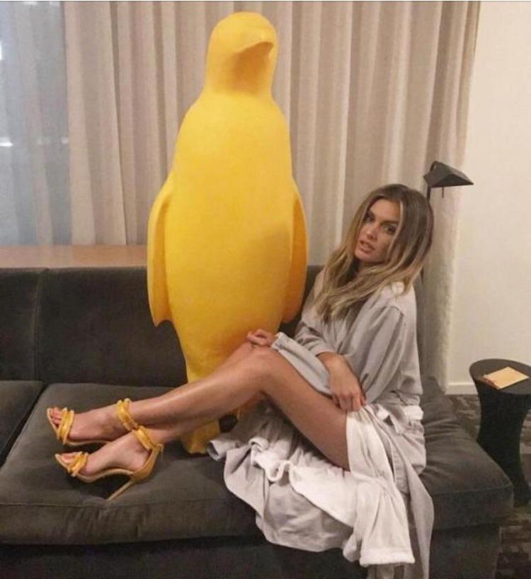 Yellow heels digging in to the couch | Scrolller