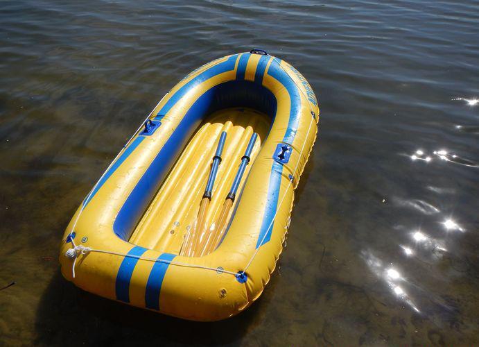 Yellow inflatable boat. | Scrolller