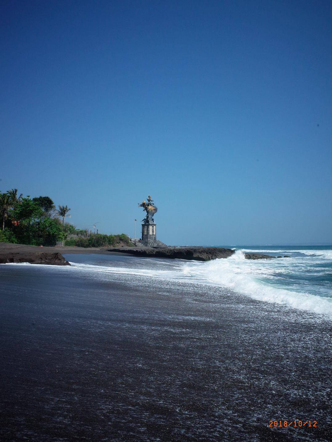A black sand beach in Bali | Scrolller