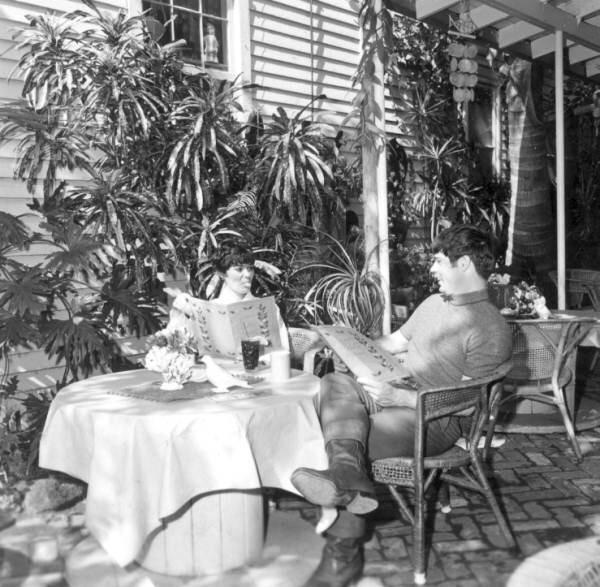 A couple dining at the Pigeon Patio - Key West, Florida (1970) | Scrolller