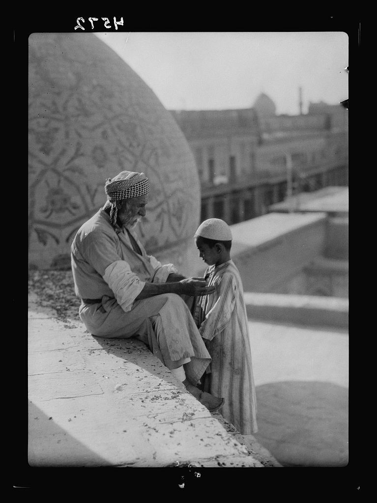 An imam with his grandson, Baghdad, 1932. | Scrolller