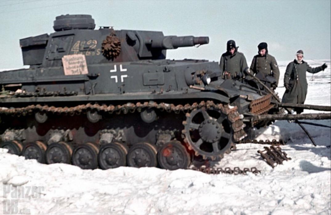 A Panzer IV with a damaged track being recovered in Russia during the Winter of 41/42 | Scrolller