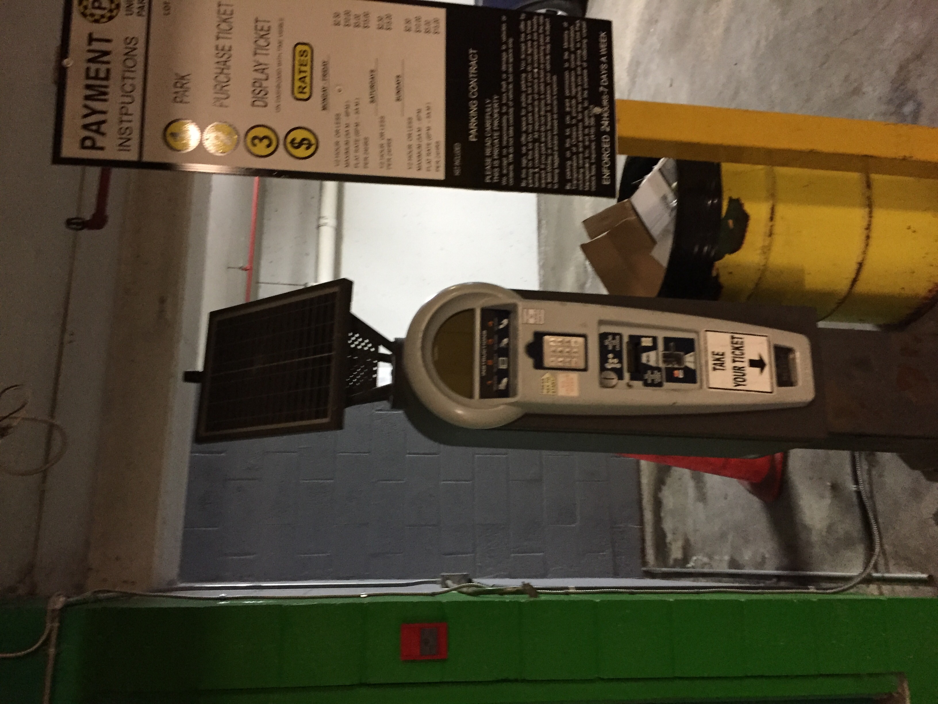 A solar powered parking meter in an underground garage. | Scrolller