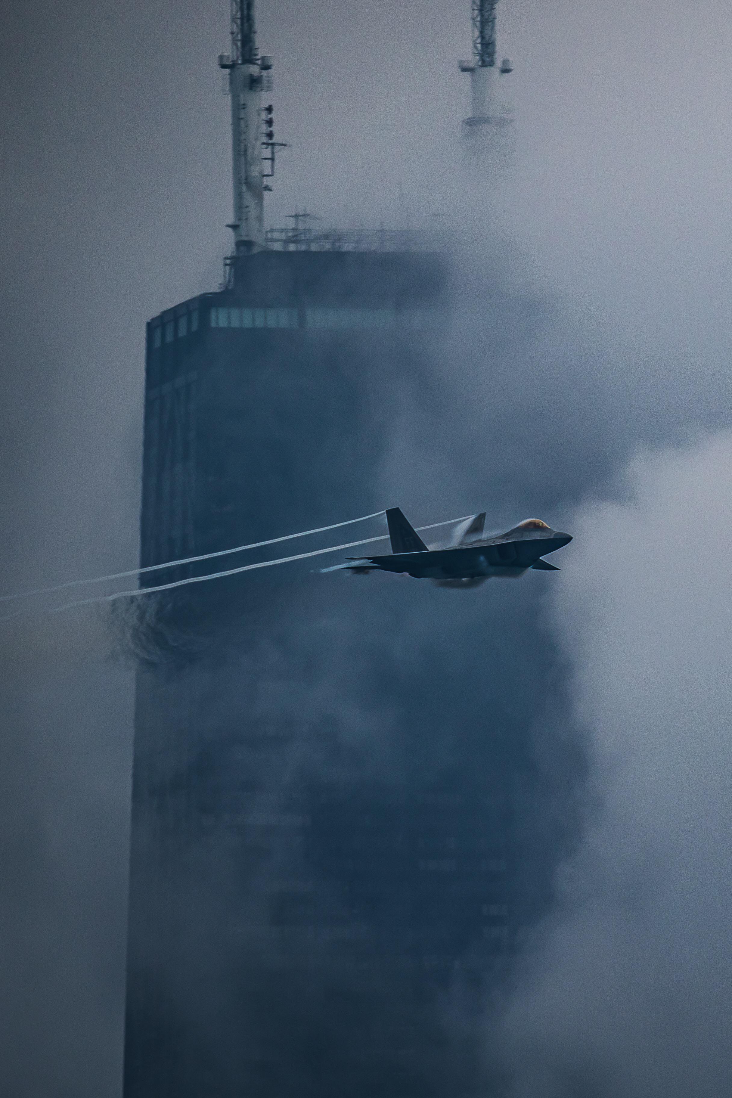 An F-22 Raptor streaks past the John Hancock Center during Chicago’s Air & Water Show, 18 August ...