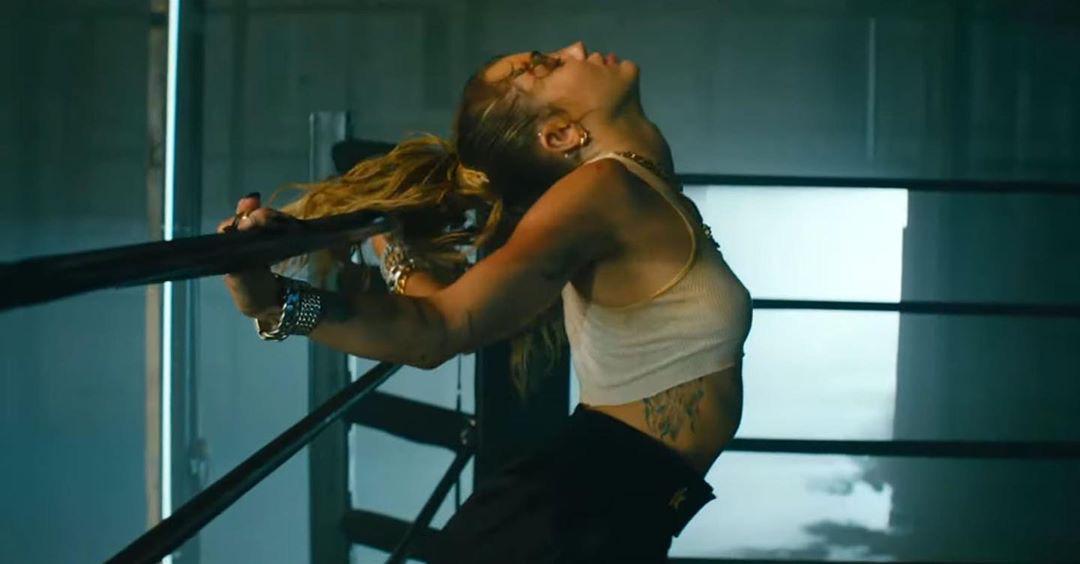 Arching her back. | Scrolller