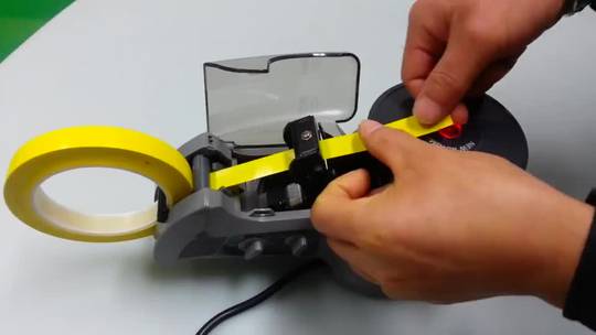 Automatic tape dispenser. | Scrolller