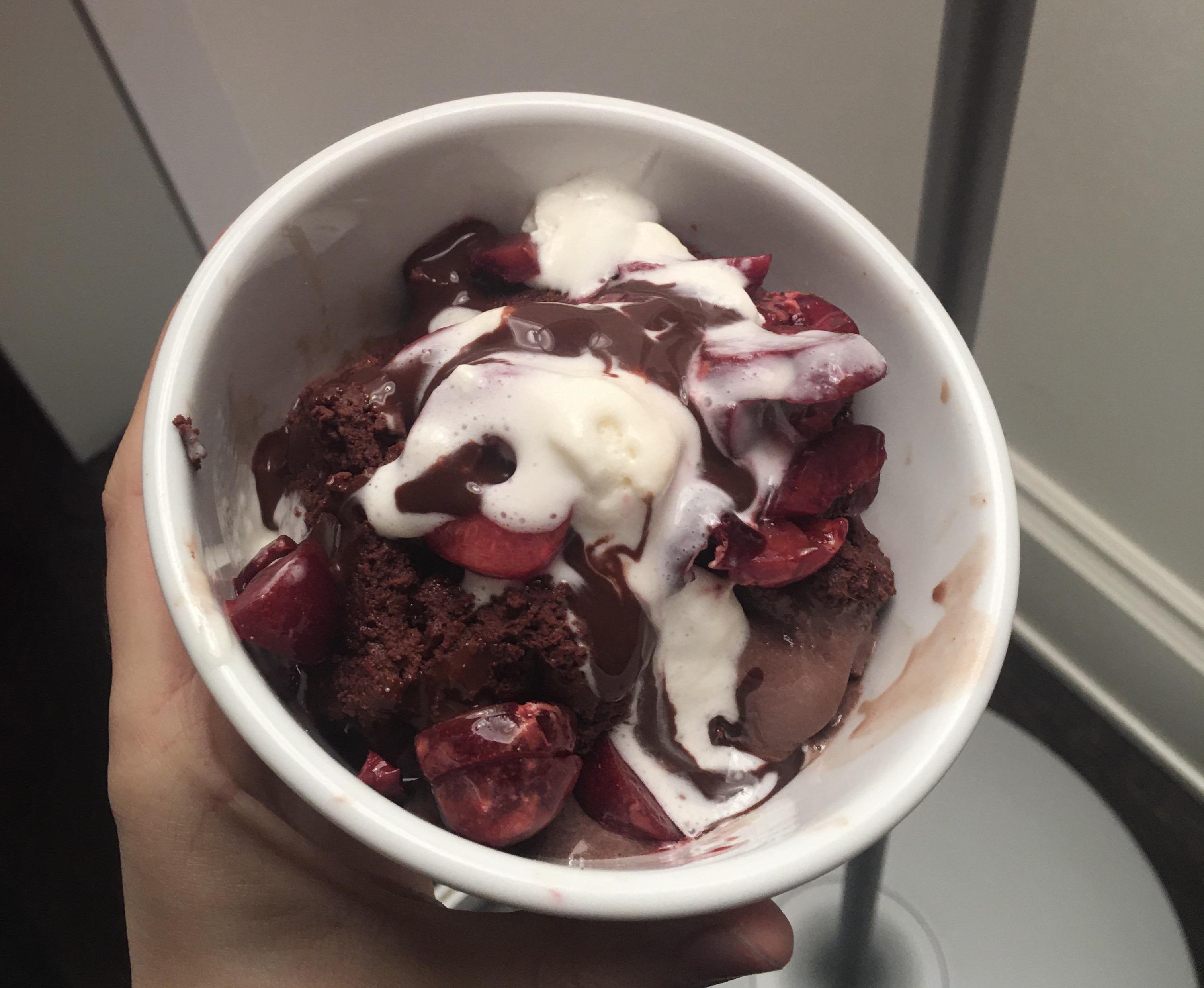 awful photo but chocolate ice cream, brownies, and frozen cherries topped with a lil whipped ...