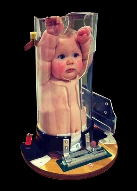 Baby in x-ray device. | Scrolller